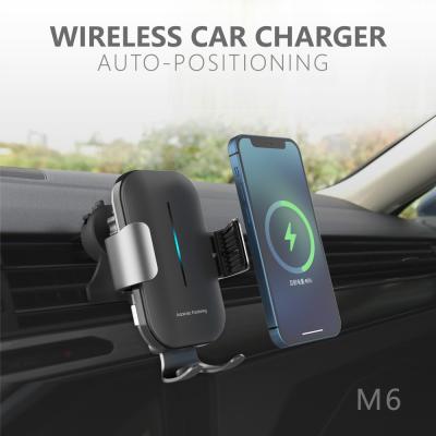 China do carregador sem fio do carro de 15W Qi auto aperto de carregamento rápido e montagem inteligente do carro da área de carregamento do alinhamento para iPhone13 à venda