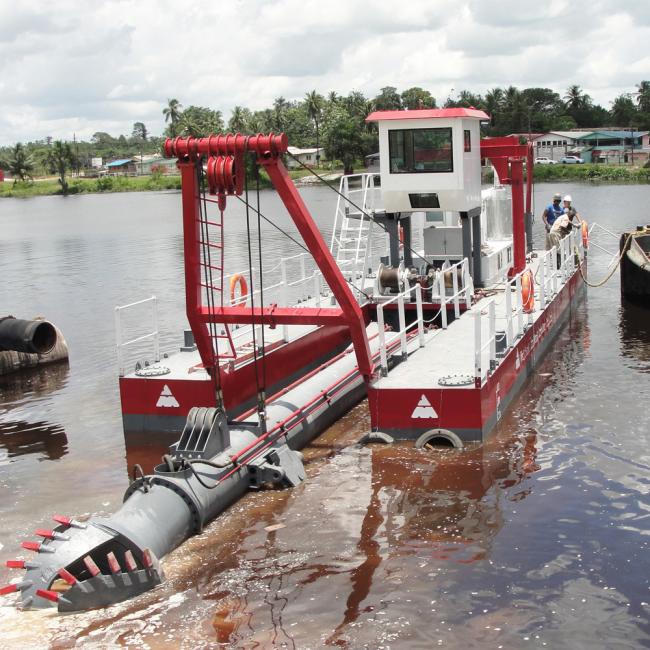 Dredger working in river
