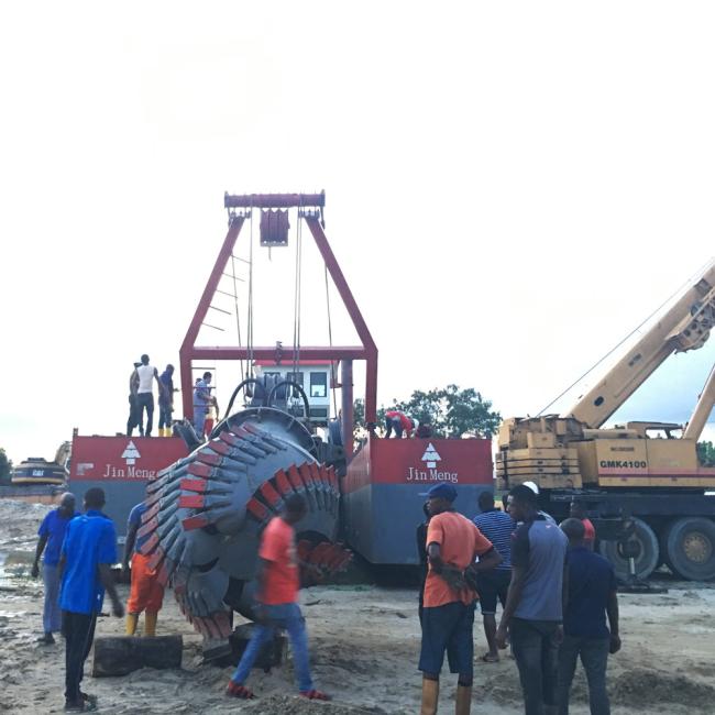 Close-up of dredger in operation