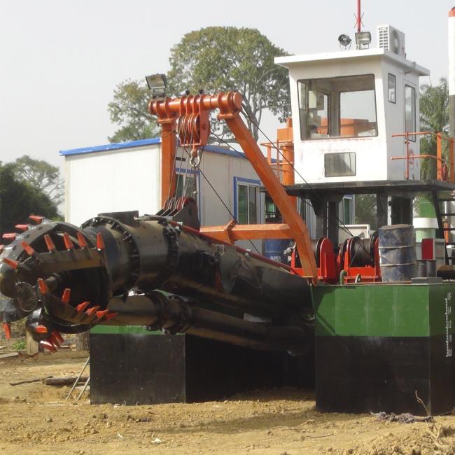 Dredger equipment performing pond maintenance