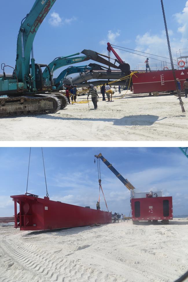 Engineers installing dredger components