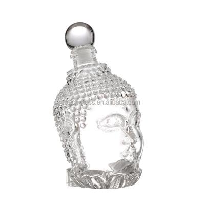 China Garrafa de vidro transparente de 500 ml de 700 ml de 750 ml de capacidade em forma triangular para brandy à venda