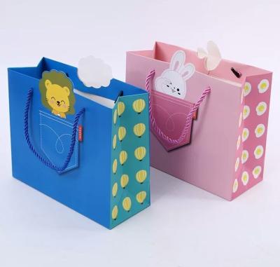 China Custom Luxury Gift Garment Paper Shopping Bags With Logo Print for sale