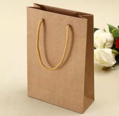 China Custom Luxury Gift Garment Paper Shopping Bags With Logo Print for sale