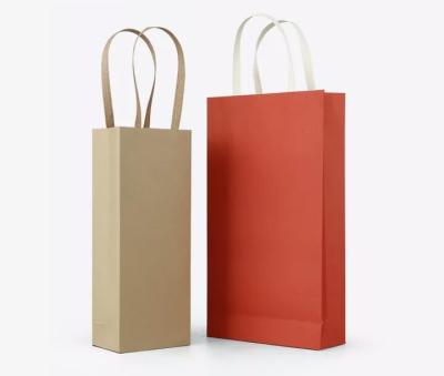 China Custom Luxury Gift Garment Paper Shopping Bags With Logo Print for sale