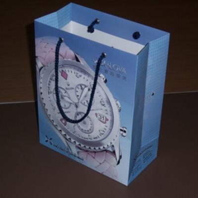 China Custom Luxury Gift Garment Paper Shopping Bags With Logo Print for sale