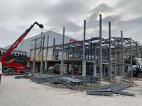 China Customizable Steel Structure Warehouse Building With Rolling Door for sale
