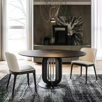 China Muebles modernos italianos para el hogar, comedor, mesa redonda giratoria con base de acero inoxidable negro y encimera de cerámica tipo roca o mármol en venta