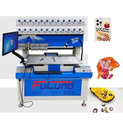 Cina Drip mold machine to make shoe key chain logo label toy trinket or shoe cover processing pvc glue dispenser for factory in vendita