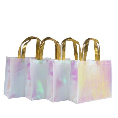 China Uitstalling Custom Logo Roze Holografische Niet-geweven iriserende tas voor trouwgeschenk Te koop
