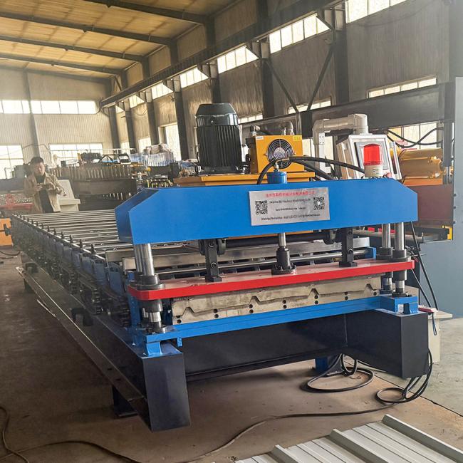 Roofing sheet roll forming machine in operation