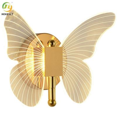 China Luxury Butterfly Modern Wall Lamp Hotel Bed And Bedroom TV Wall LED Three Color Light for sale