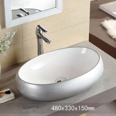 China Bathroom ceramic new oval modern hand wash basin in factory price slivery counter luxury oval sink for sale
