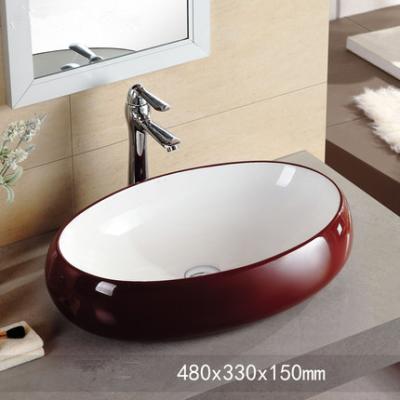 China Fashion red color ceramic bathroom hotel countertop wash basin no hole oval hand luxury sink for sale