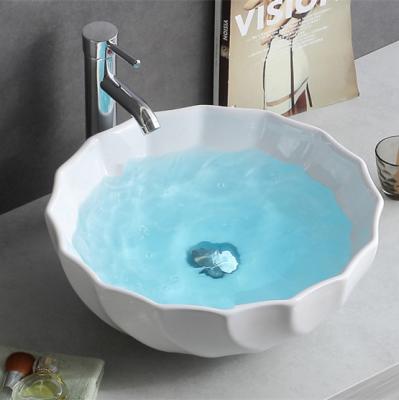 China Bathroom white color ceramic new design round durable fancy tabletop wash hand table art basin for sale