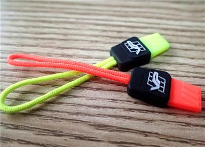 China Fluorescent Color Rubber Zipper Puller With Embossment Logo For Garment , Bags , Luggages for sale