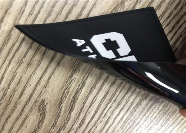 Quality Embossed White Character With Black Background Soft PVC Patches With Sewing Line for sale