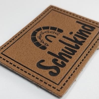 China Microfiber geïmprimeerd logo PU leerlabel Naai op kleding Aanpassen ontwerp for sale