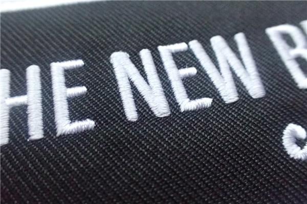 Quality Washable Black Polyester Custom Clothing Patches / Adhesive Embroidered Patches for sale