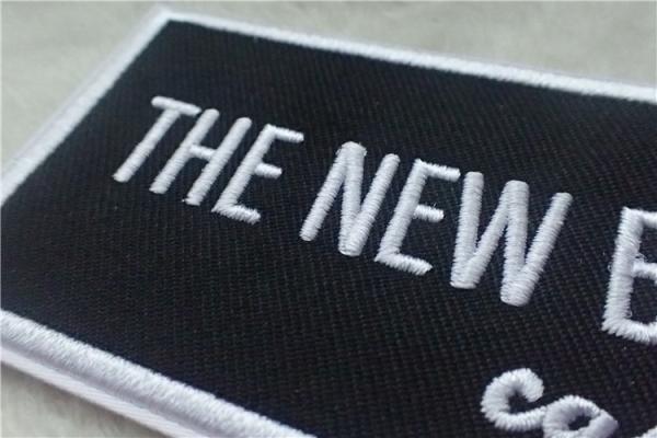 Quality Washable Black Polyester Custom Clothing Patches / Adhesive Embroidered Patches for sale