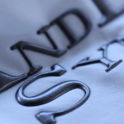 China Custom Design Letters High Frequency Embossed Brand Label 3D TPU Logo Heat Transfer Iron on Labels for Clothing Te koop