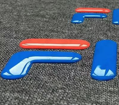 China 3D Embossed Shine Logo Iron-on Clothes Heat  Rubber Badge Silicone Heat Transfer Patch for sale