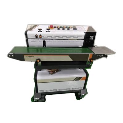 China Automatic Vacuum Filling Nitrogen Gas Flushing Continous Band Sealer Machine Bag Sealing Machine With Code Printer for sale