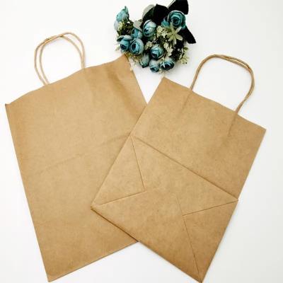 China Kraft Paper Packaging Bag Gift Crafts Shopping Biodegradable Bag With Twisted Handle for sale