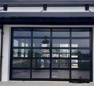 中国 Modern Aluminum Glass Sectional Garage Door Secures With Sleek Sectional Design 販売のため