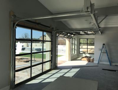 中国 手動または自動 水密度 3 クラス 透明ガラス 絶好の隔熱性のある切断ガレージドア 販売のため