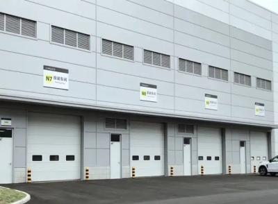 China Fire Station Automatic Heavy-Duty Industrial Overhead Lifting Door | PU Panel Sectional Overhead Doors with Weather-sealed Design and Industrial Sectional Doors for sale