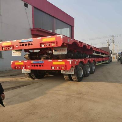 中国 2軸 30トンの低床車体 2速着陸脚を持つ低平床半トレーラー 販売のため