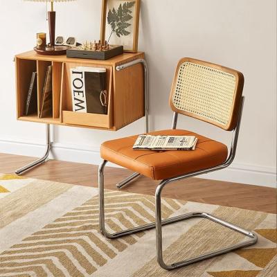 China Simple Comfortable Solid Wood Home Dining Chair Stainless Steel  Conference Cafe Rattan Leisure Chair for sale