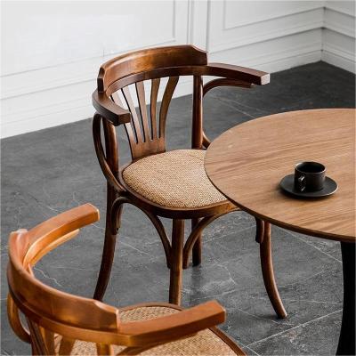 China Simple Household Armrest Dining Chair Small Apartment Nordic Retro Backrest Leisure Rattan Dining Chair for sale