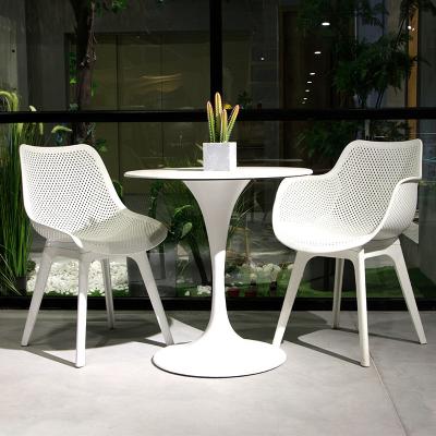 China Outdoor Table and Chair Homestay Armrest Leisure PP Plastic Back Chairs Coffee Table for sale