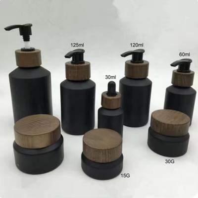 Cina 30g,50g,15ml,30ml,60ml,120ml, Green Frosted Glass Bottle With Wooden Screw Lid in vendita