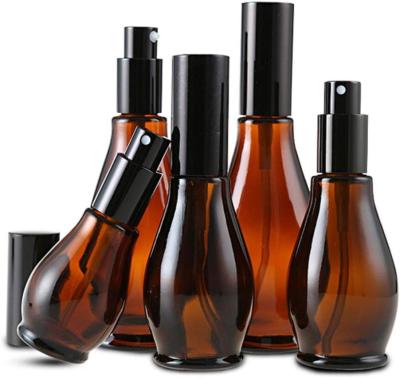 China 100ml Amber Glass Travel Bottles Cosmetic Cream Pump Bottle Dispenser Container for sale
