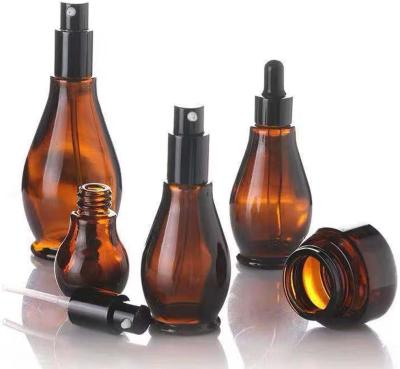China 100ml Amber Glass Travel Bottles Cosmetic Cream Pump Bottle Dispenser Container for sale