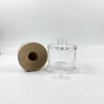 China 50ml Clear Glass Diffuser Bottles with Wooden Cap Perfume Luxpry Glass Bottles for sale