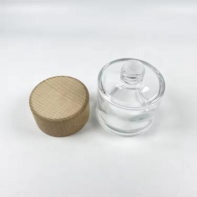 China 50ml Clear Glass Diffuser Bottles with Wooden Cap Perfume Luxpry Glass Bottles for sale