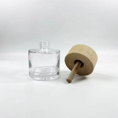 China 50ml Clear Glass Diffuser Bottles with Wooden Cap Perfume Luxpry Glass Bottles for sale