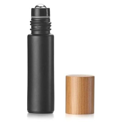 China 10ml 22/400 Essential Oil Bottles Bamboo Cap 22mm Clear Glass Roller Bottles for sale