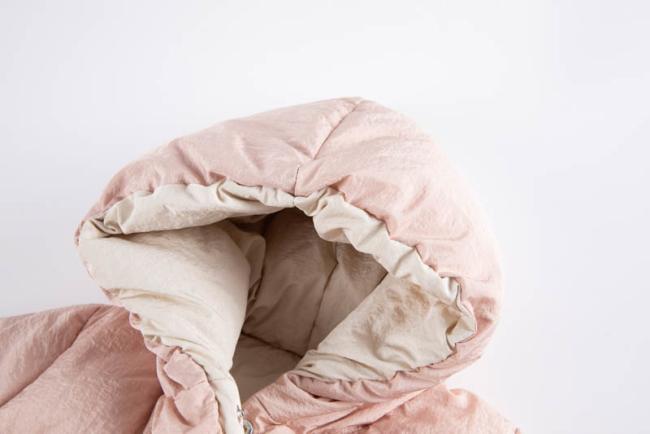 Toddler reversible puffer jacket in blush pink and cream colors