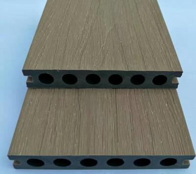China 140X23 cheap wpc capped hollow decking flooring outdoors with 25 years guranteen for sale