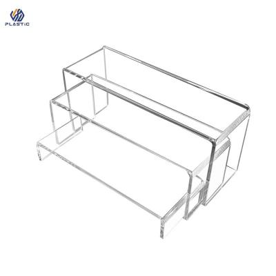China Customized Shape Acrylic Display Stand Clear Acrylic Risers For Shopping Malls for sale