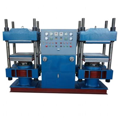 China Vulcanizador de compresión de caucho de calefacción eléctrica para diseño de doble estación en venta