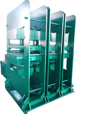 China Máquina de vulcanização plana de camada de vedação de borracha de trocador de calor - camada de trabalho dupla - prensagem a quente manual de entrada e saída do molde à venda