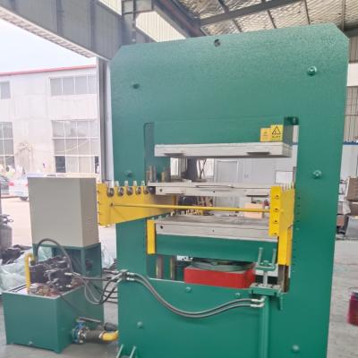 China Máquina de vulcanização plana de camada de vedação de borracha de trocador de calor - camada de trabalho dupla - prensagem a quente manual de entrada e saída do molde à venda