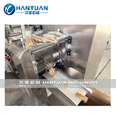 Cina Macchina confezionatrice a cuscino per alimentazione a piastra ad alta velocità per barrette al caramello in vendita