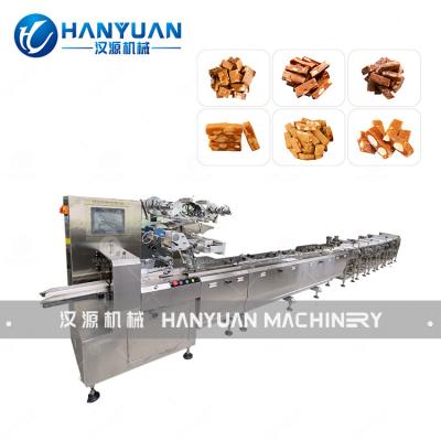Cina Macchina confezionatrice a cuscino per alimentazione a piastra ad alta velocità per barrette al caramello in vendita